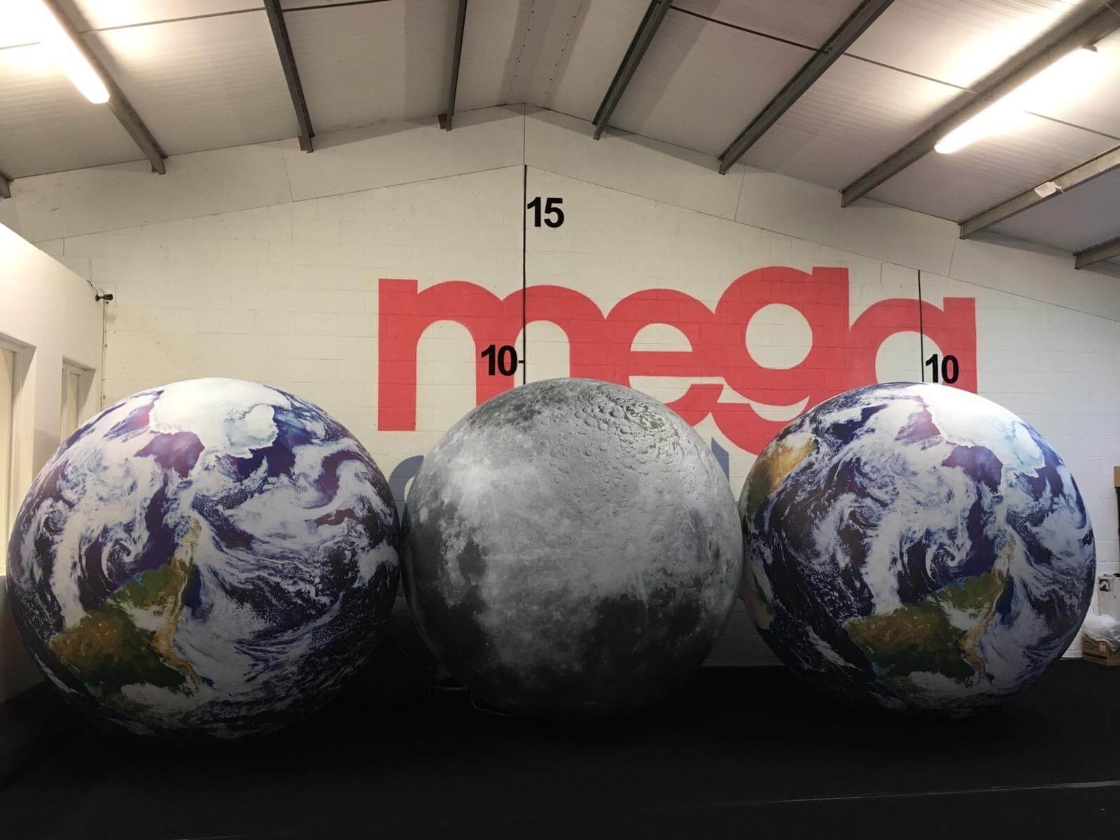 Inflatable planets – enquire about custom space inflatables