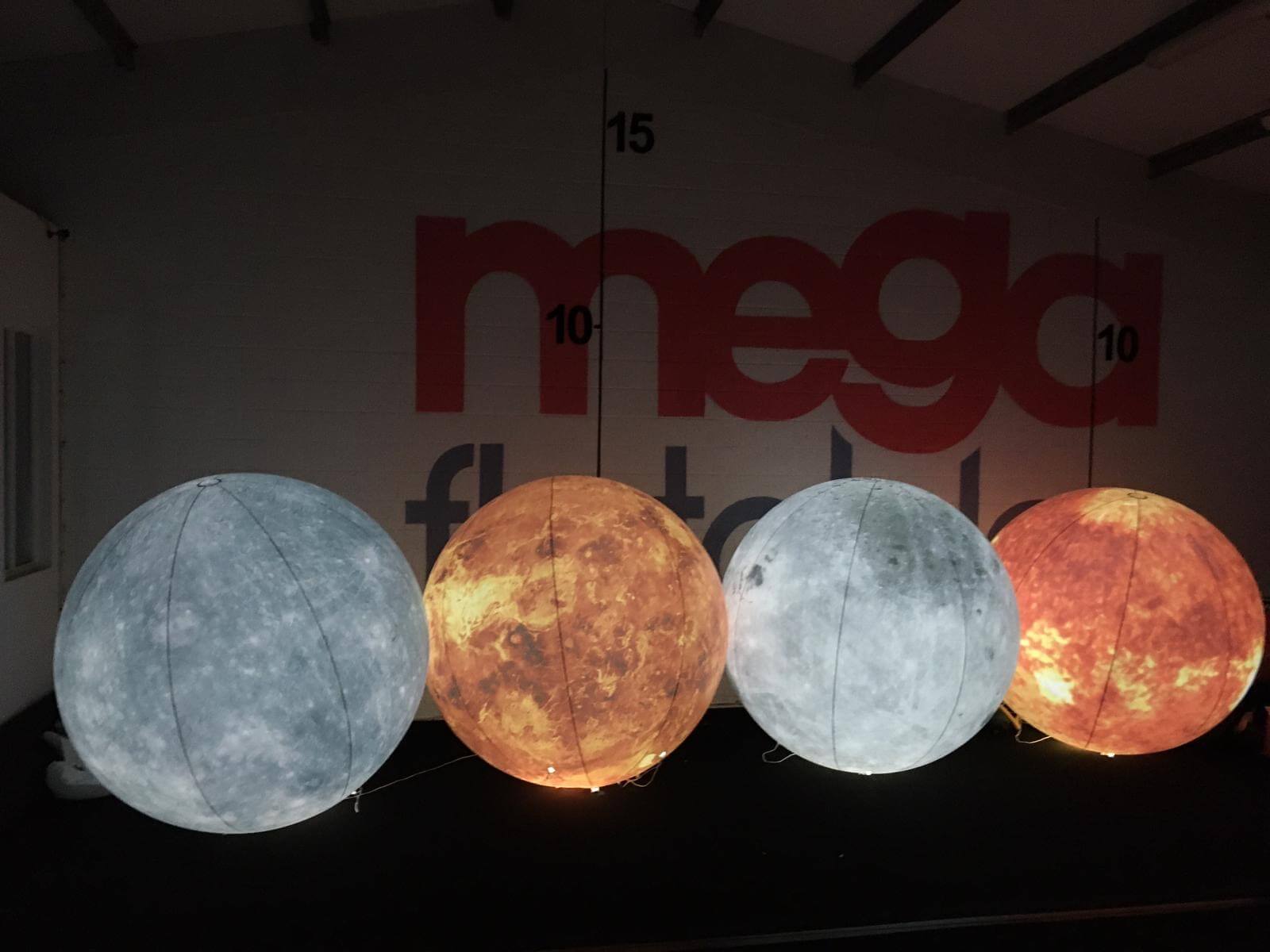 Inflatable planets – enquire about custom space inflatables