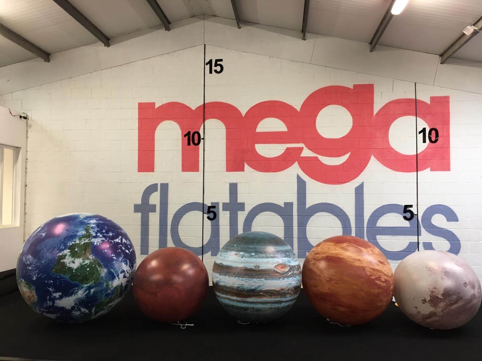 Inflatable planets – enquire about custom space inflatables