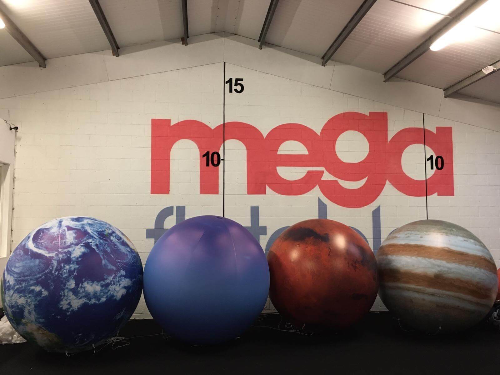 Inflatable planets – enquire about custom space inflatables