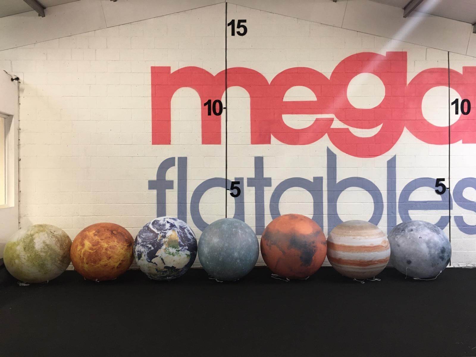 Inflatable planets – enquire about custom space inflatables